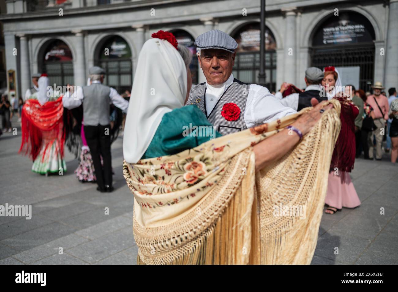Mature dancers dance the traditional chotis during the San Isidro ...