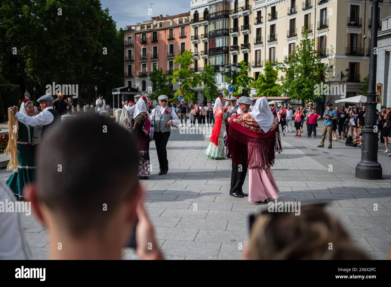 Mature dancers dance the traditional chotis during the San Isidro ...