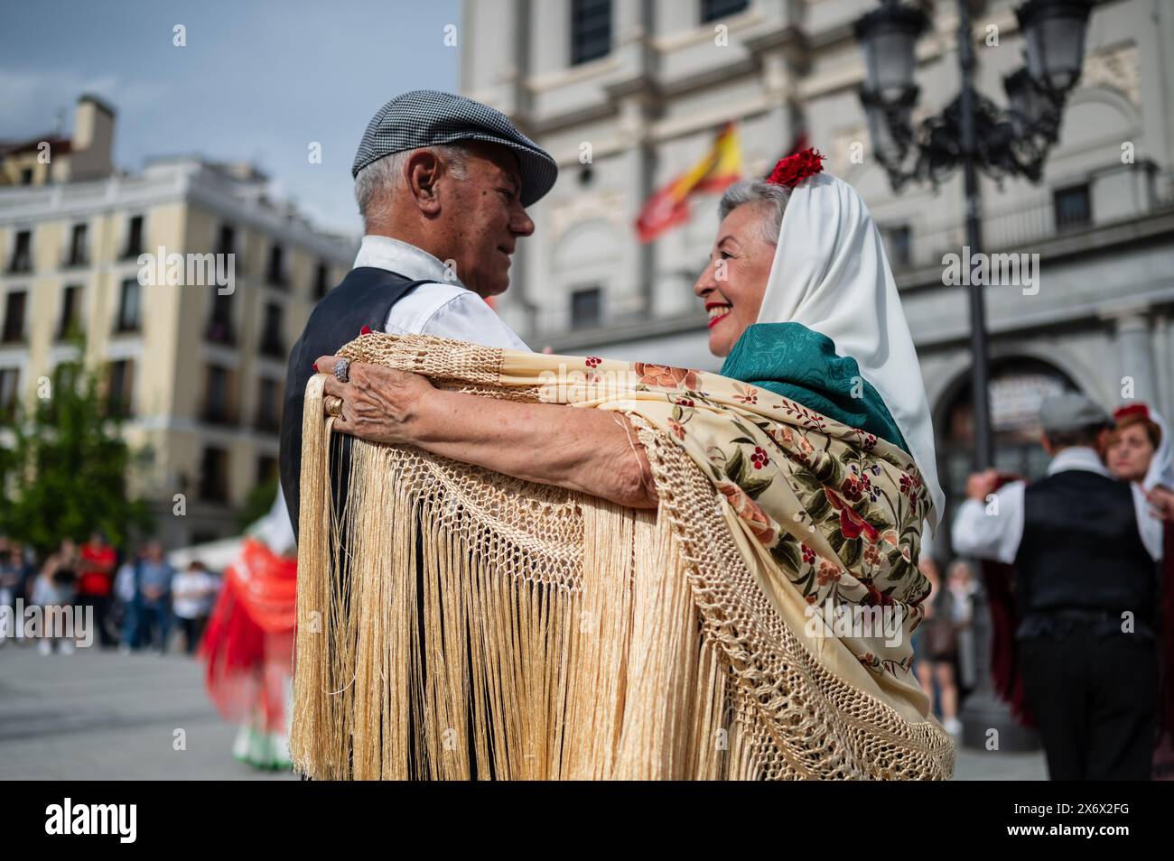 Mature dancers dance the traditional chotis during the San Isidro ...