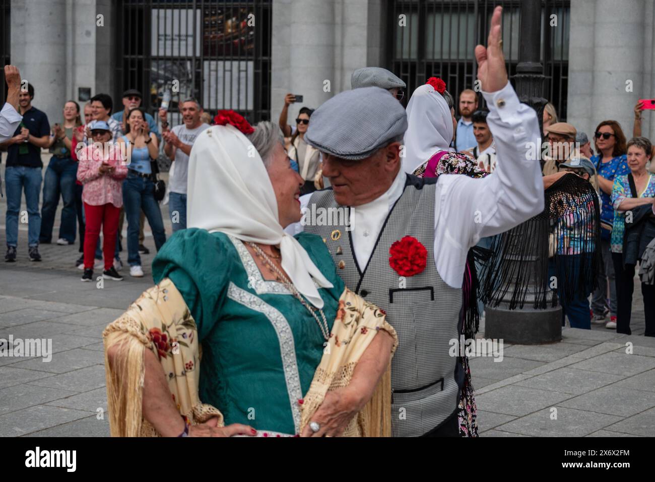 Mature dancers dance the traditional chotis during the San Isidro ...