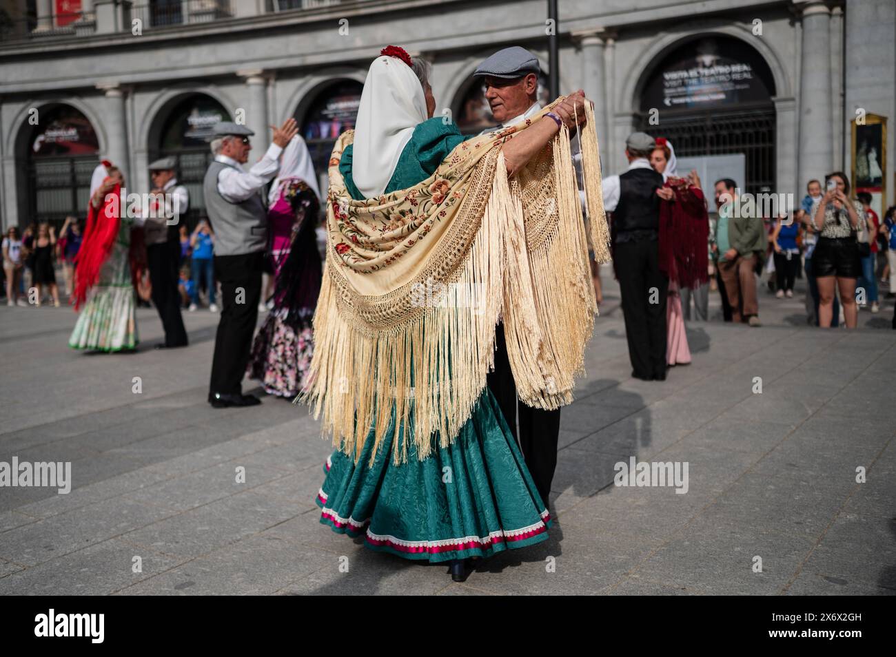 Mature dancers dance the traditional chotis during the San Isidro ...