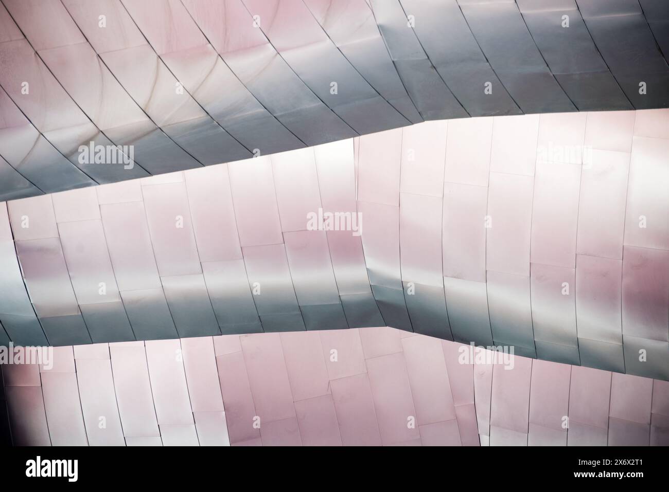 A building with a silver roof has a pattern of squares. The roof is ...