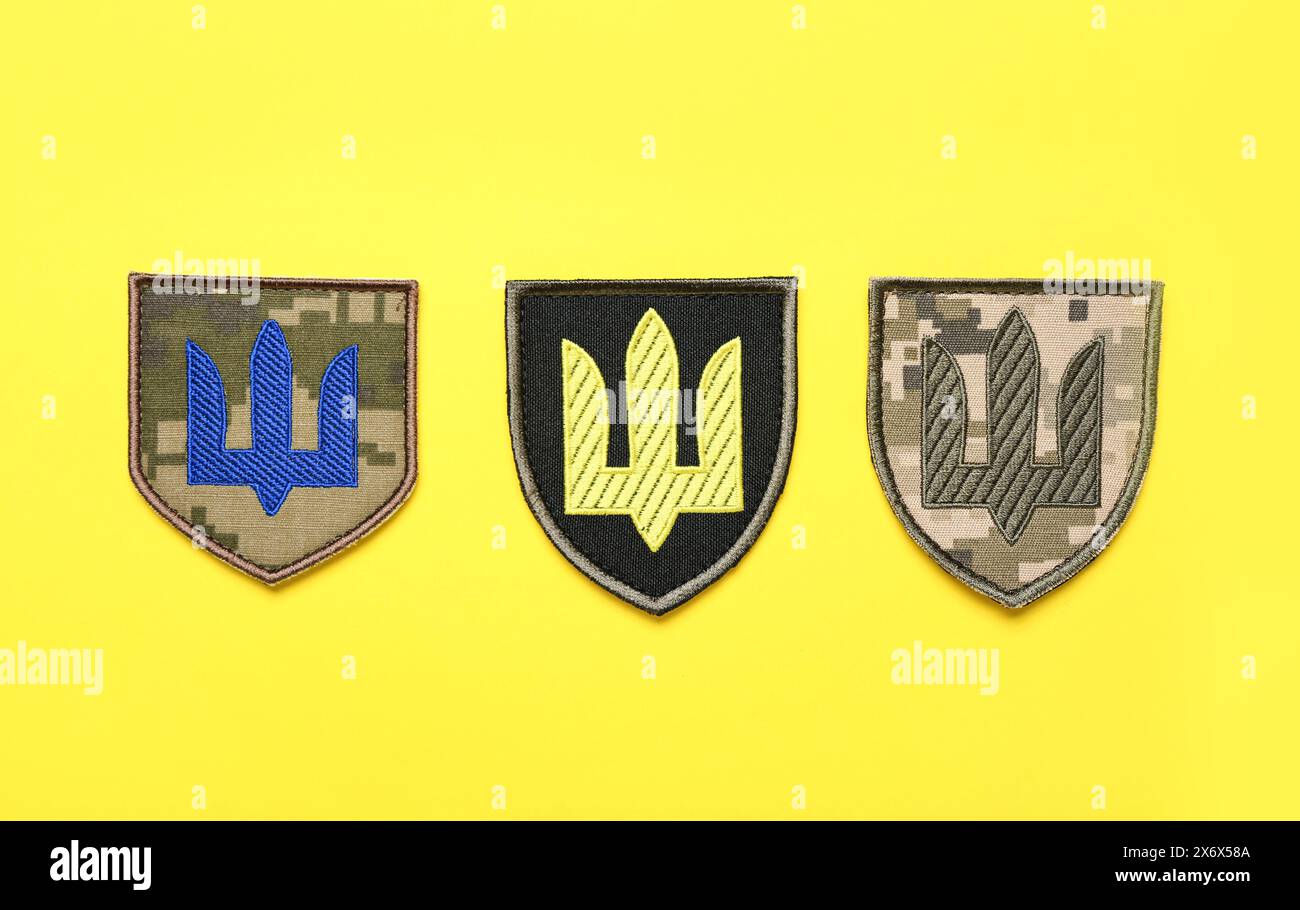 Different military badges of Ukrainian army with trident on yellow ...