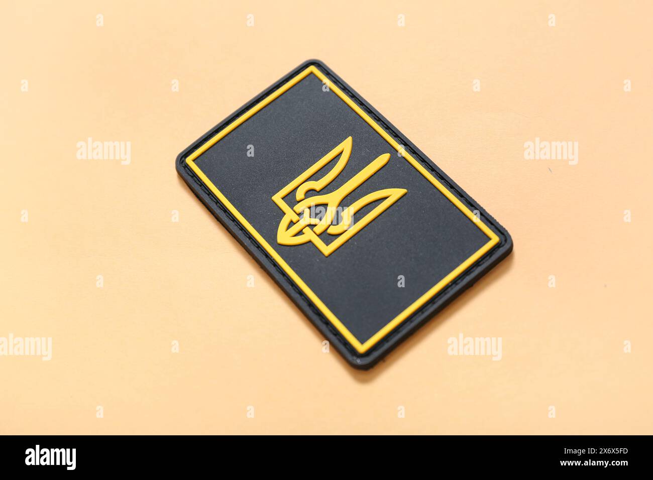 Military badge of Ukrainian army with trident on beige background Stock ...