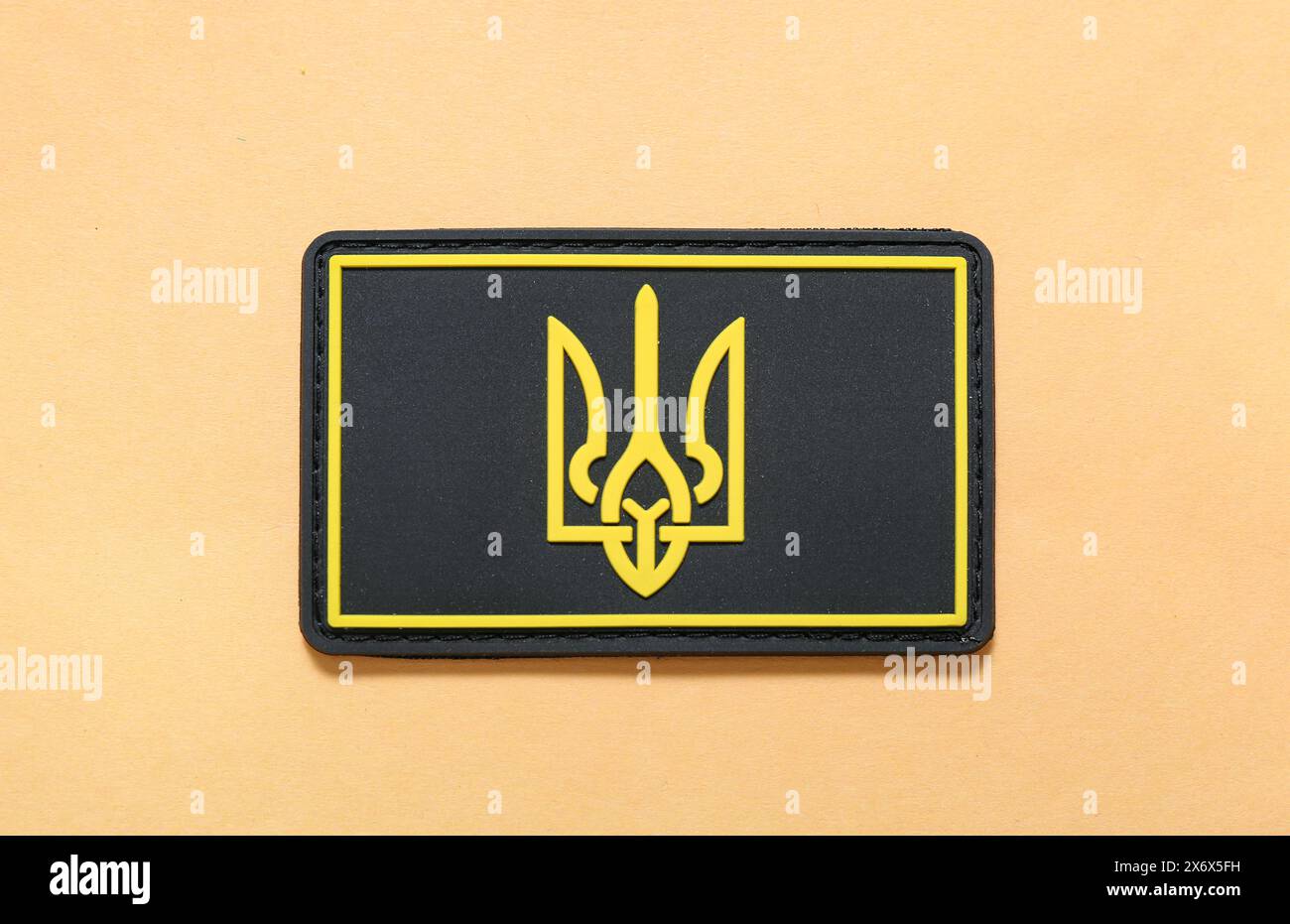 Military badge of Ukrainian army with trident on beige background Stock ...