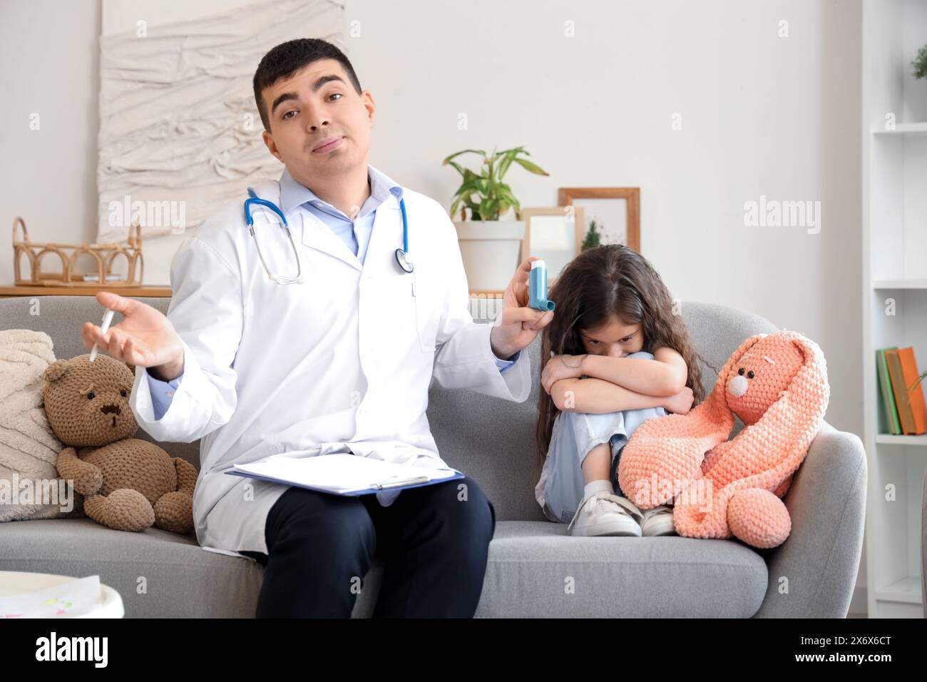 Upset little girl and doctor with inhaler at home Stock Photo - Alamy