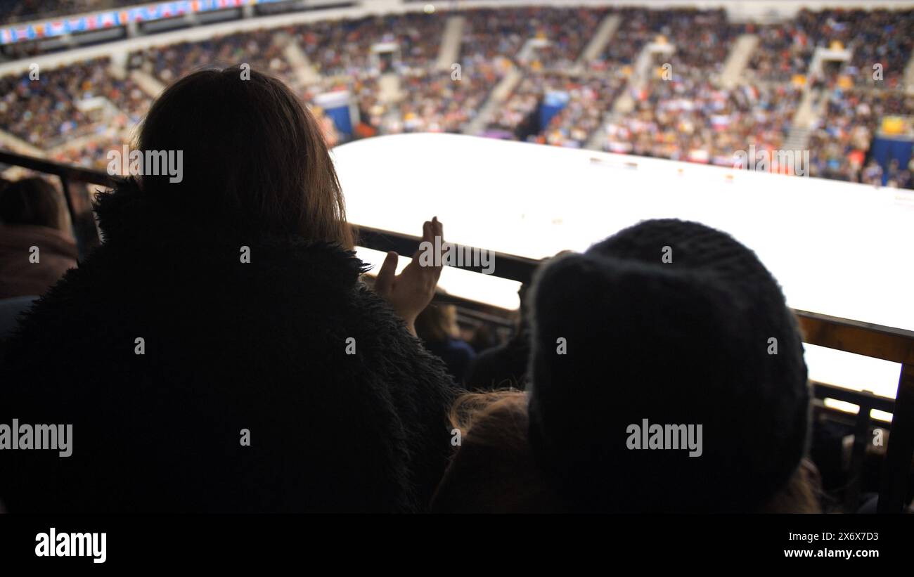 Fans sit and clap their hands on the ice arena during the World Cup in ...