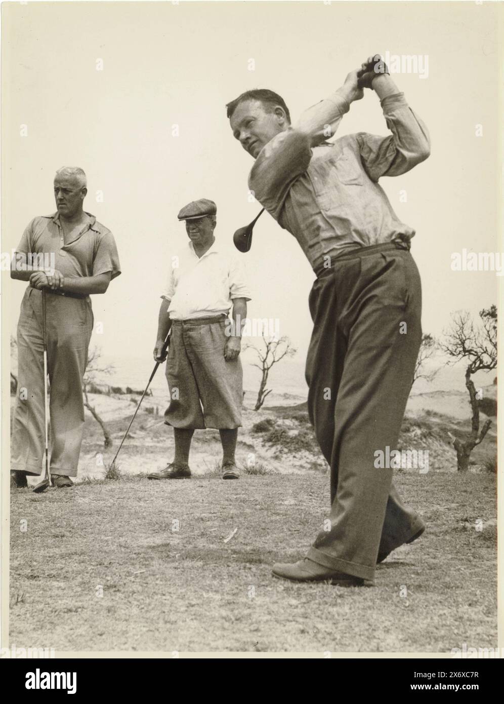 W.R. Smith drives while W.G. Walkley and E.C. Walters look on. Vintage ...