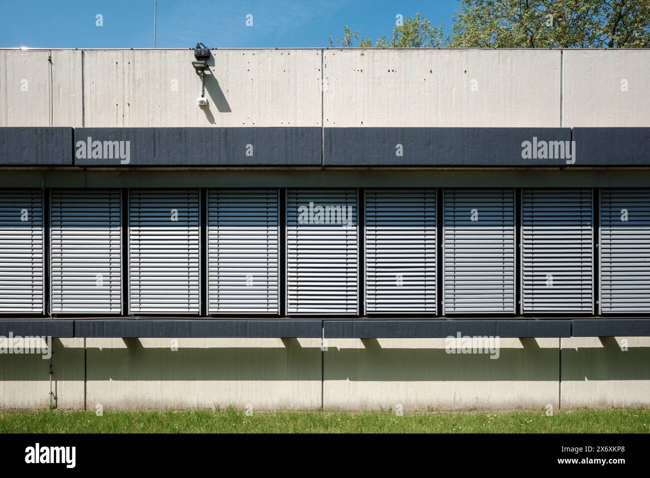 Sunny and Exterior of a modern industrial building featuring sleek ...