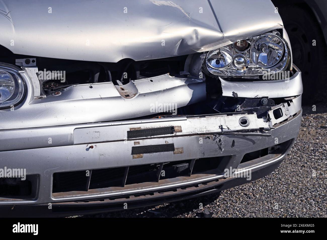 Silver car damaged by traffic accident Stock Photo - Alamy