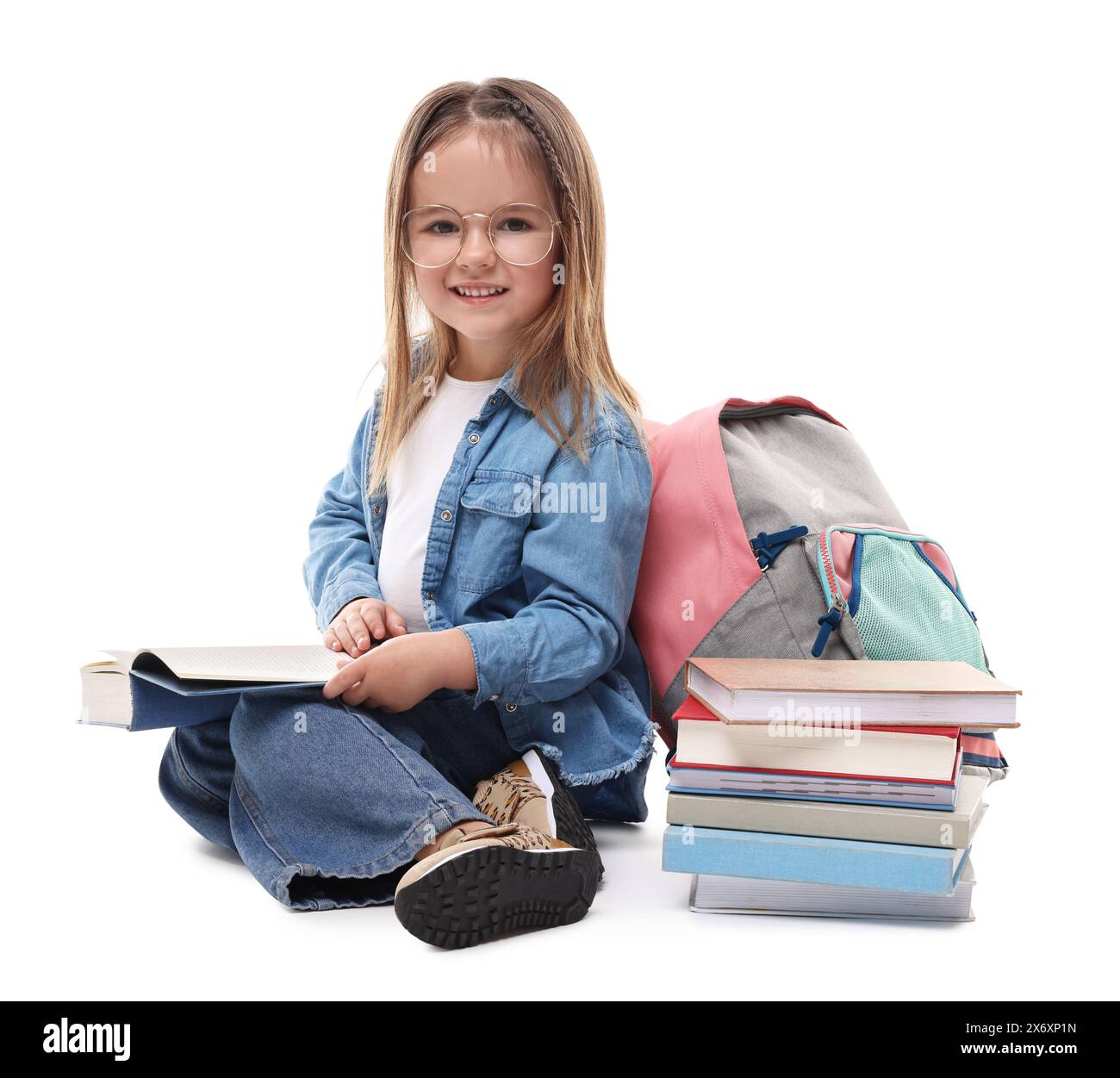 Cute little girl with books and backpack on white background Stock ...