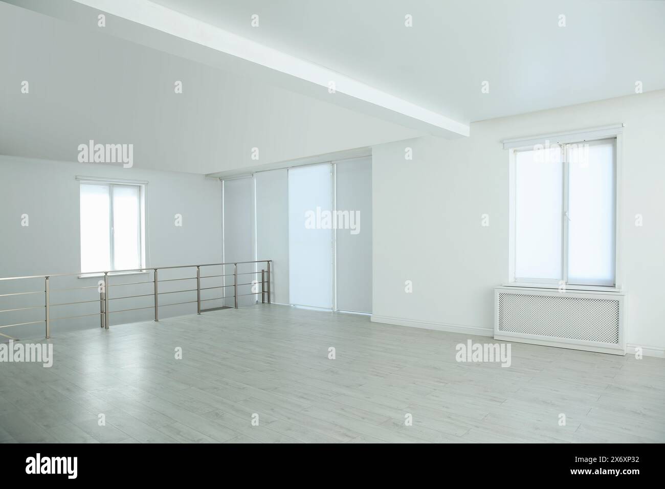 Large empty hall with windows and railings Stock Photo - Alamy
