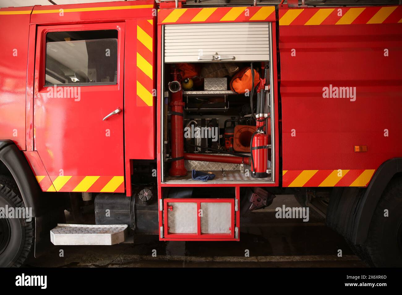 Red fire truck with safety equipment at station Stock Photo - Alamy
