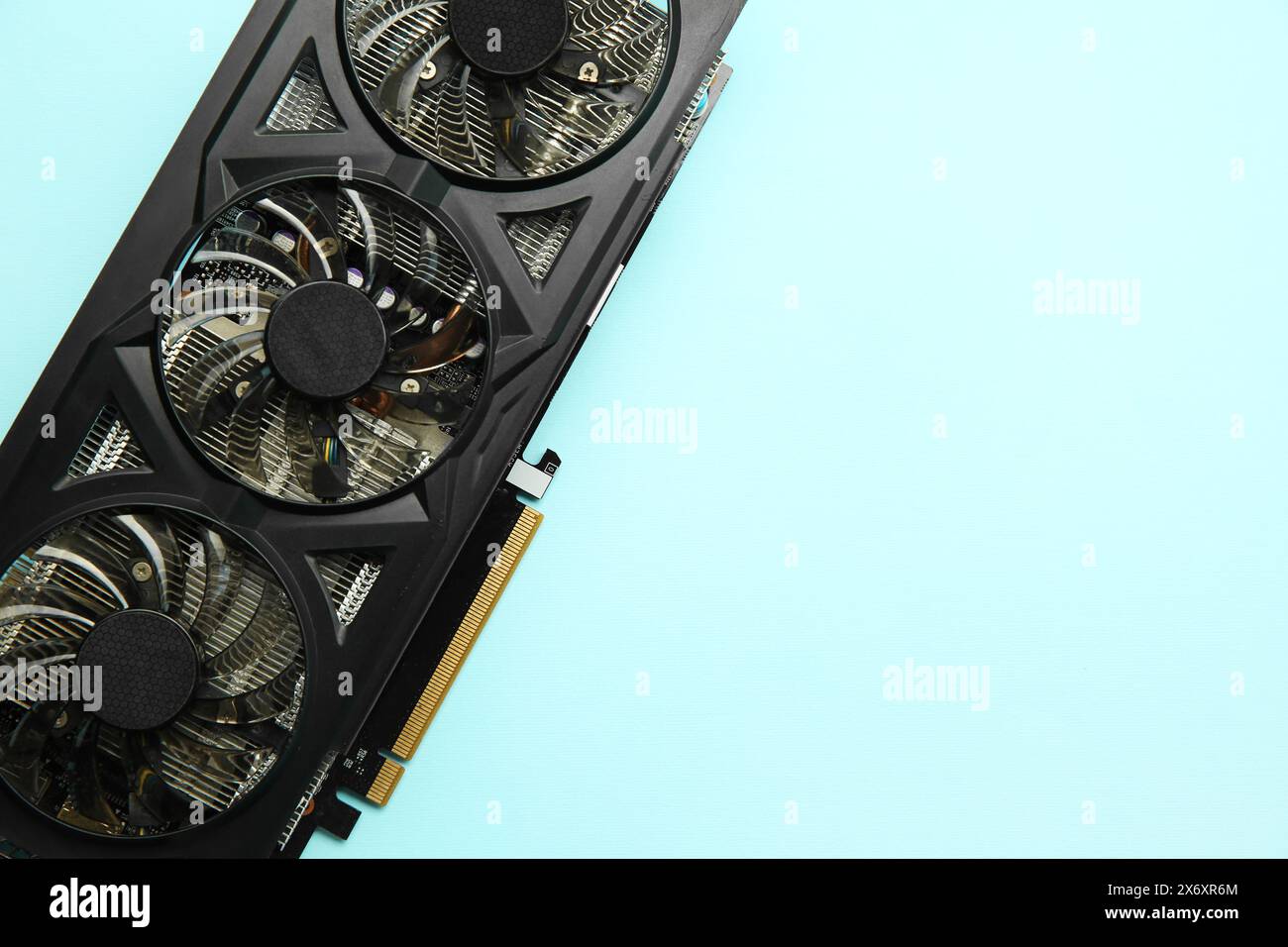 One graphics card on light blue background, top view. Space for text ...