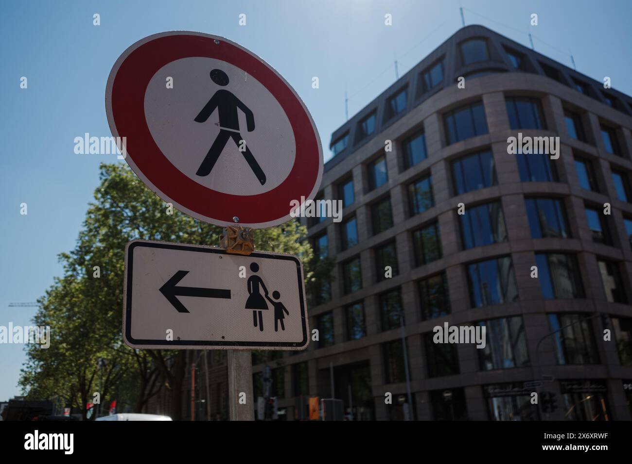 The round red sign indicates a pedestrian zone, while the rectangular ...