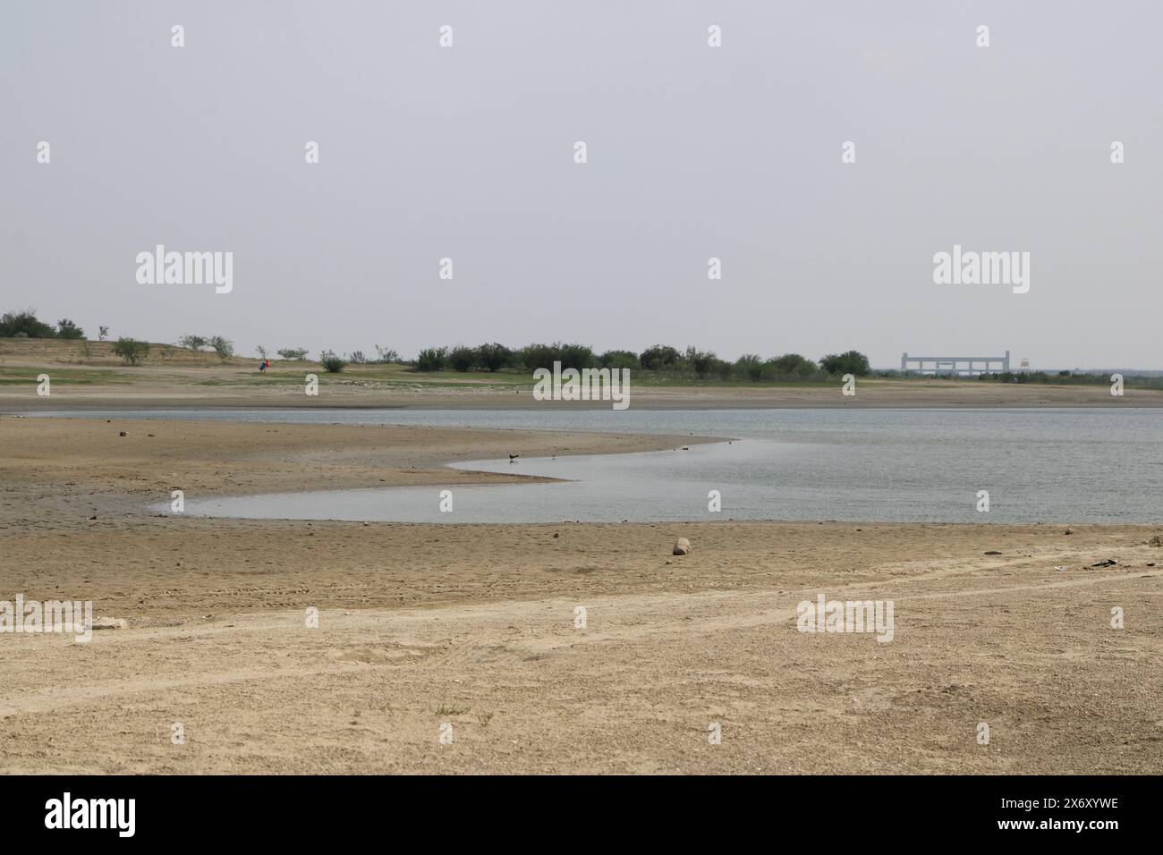 Large amounts of dry lakebed are present surrounding the current ...