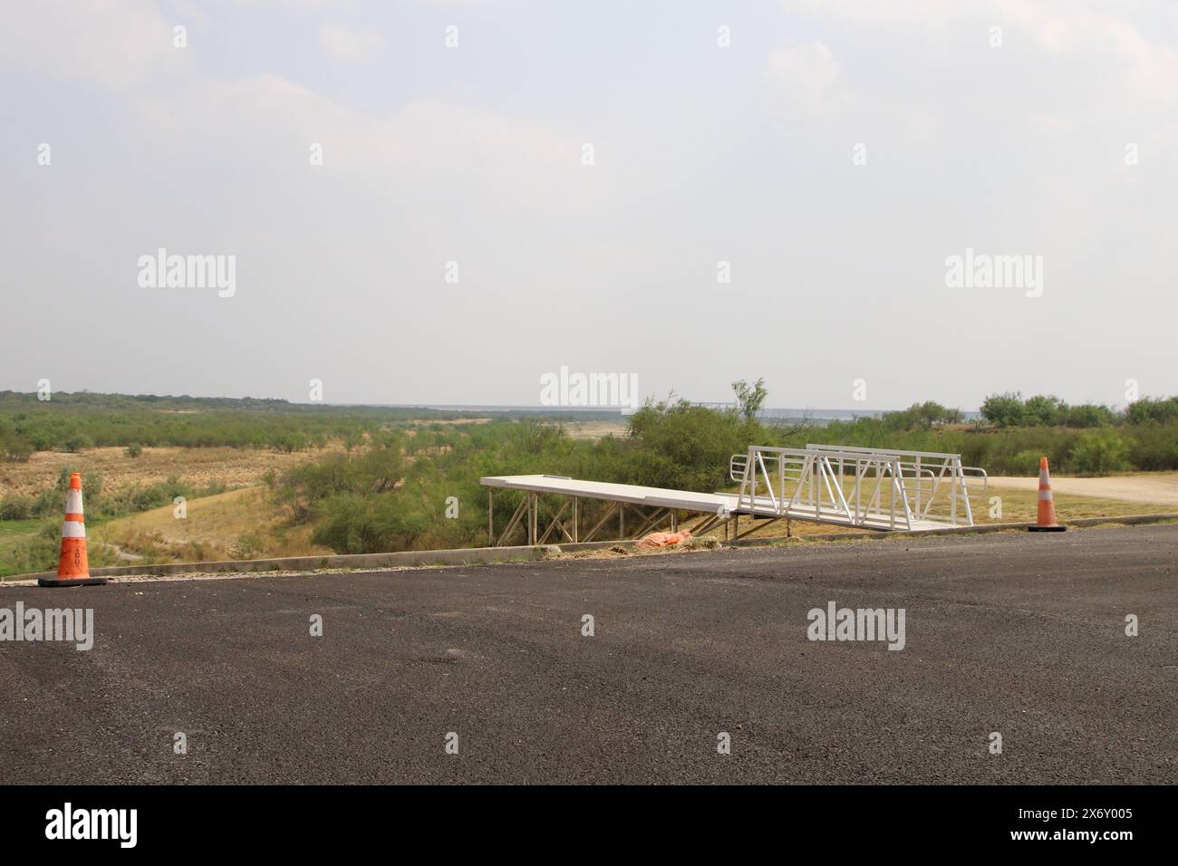 High above and far away from the current shoreline, a boat dock goes ...