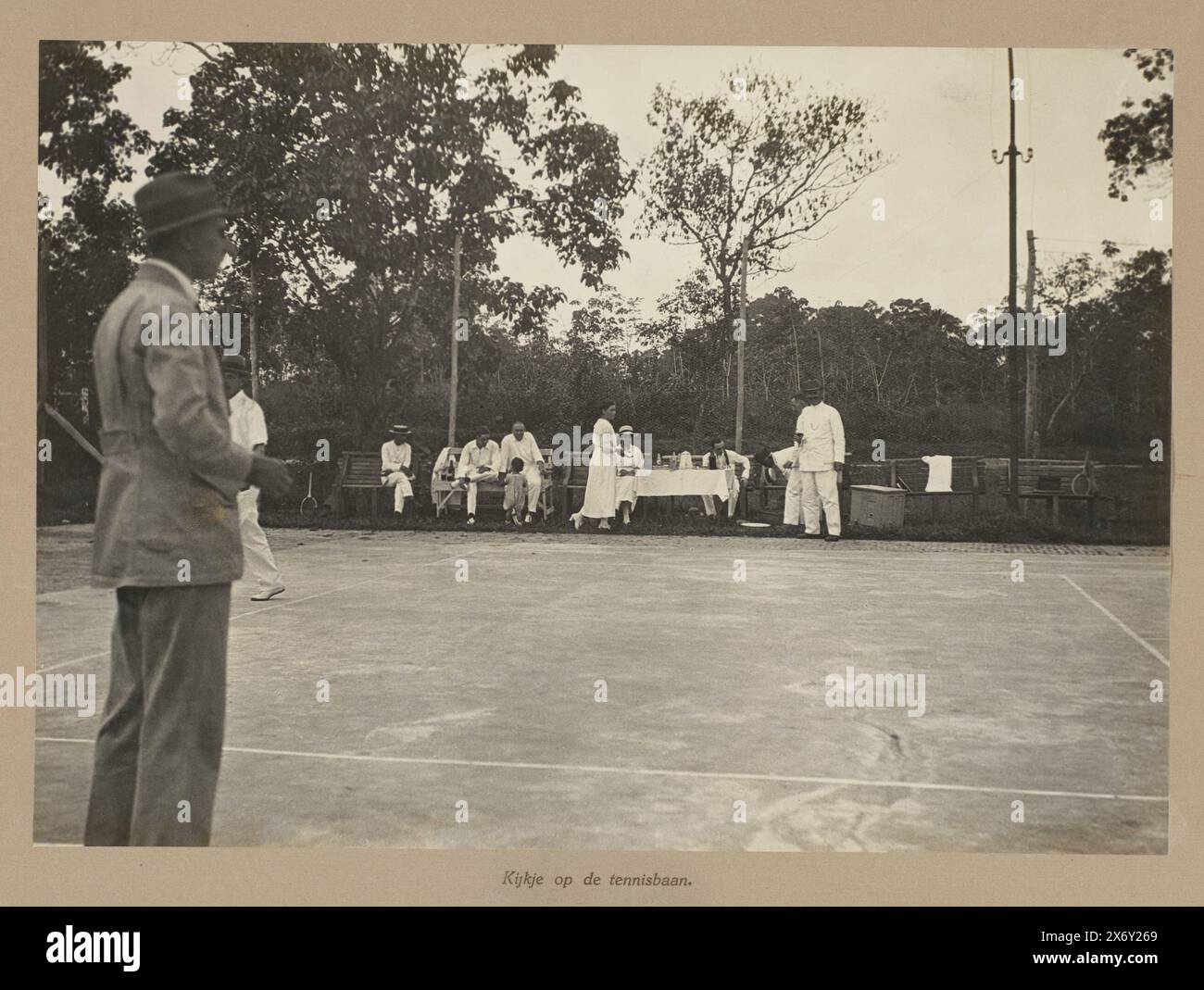 View of the tennis court (title on object), Players and spectators on ...