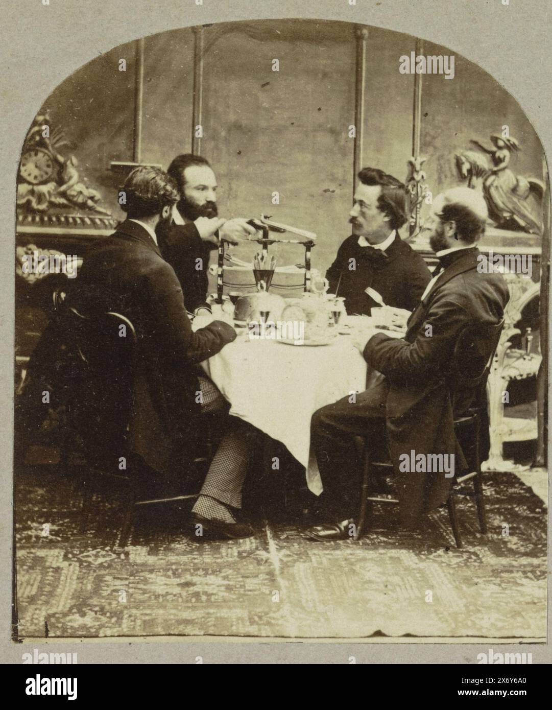 Four gentlemen sitting at a table, Four gentlemen at the table, one of ...