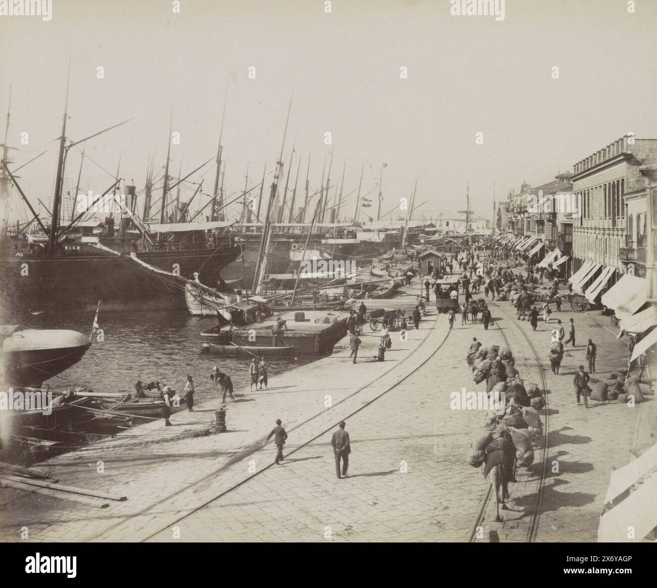 Harbor quay with loaded donkeys and ships in Smyrna, Part of Travel ...