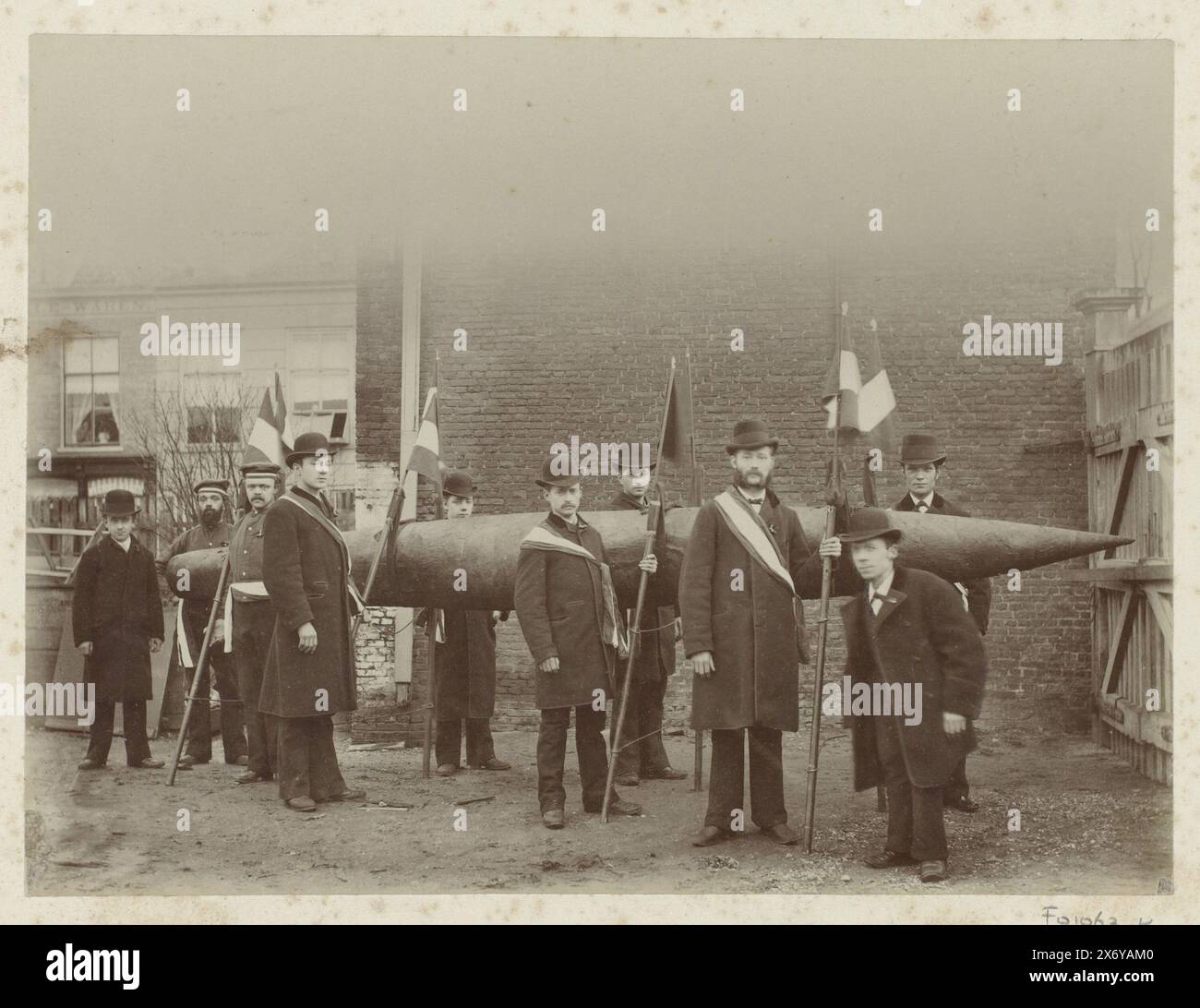 Men with flags at the 6 meter long Orange Cigar on the occasion of the ...