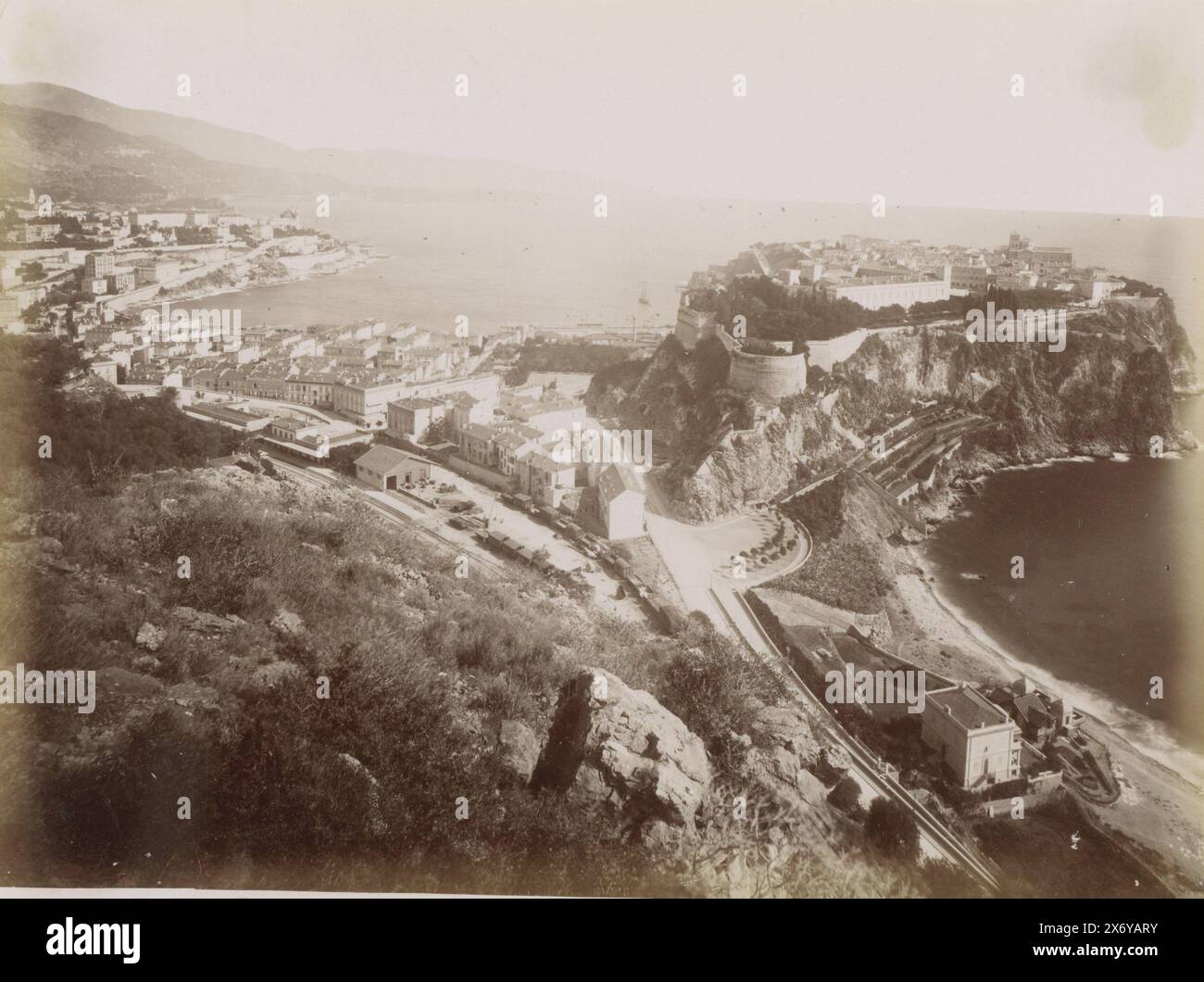 View of Monaco with the old fortified city on the right and a train ...