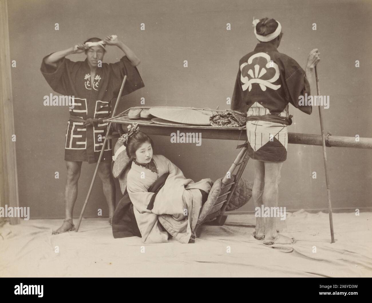 Japanese woman in a sedan chair with two porters, Part of Album with 69 ...