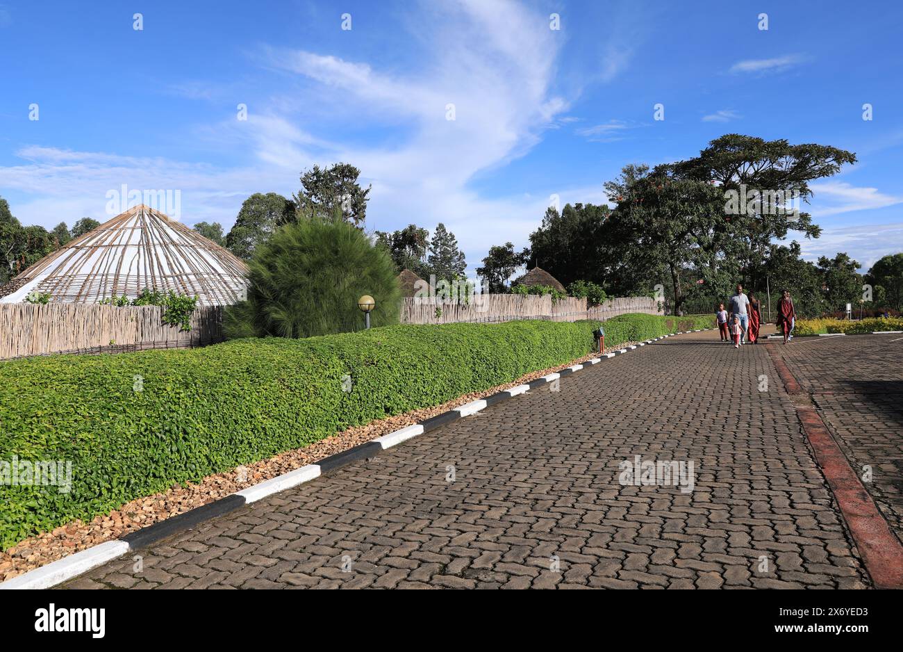 Nyanza, Rwanda. 6th Apr, 2024. Tourists pass by a traditional palace (L ...