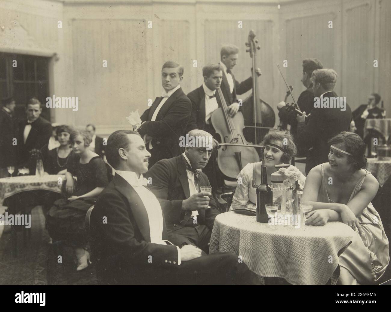 Theater company at the table of a chamber orchestra, photograph ...