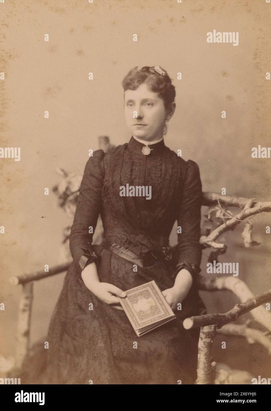 Portrait of an unknown woman with a book on her lap, cabinet photograph ...