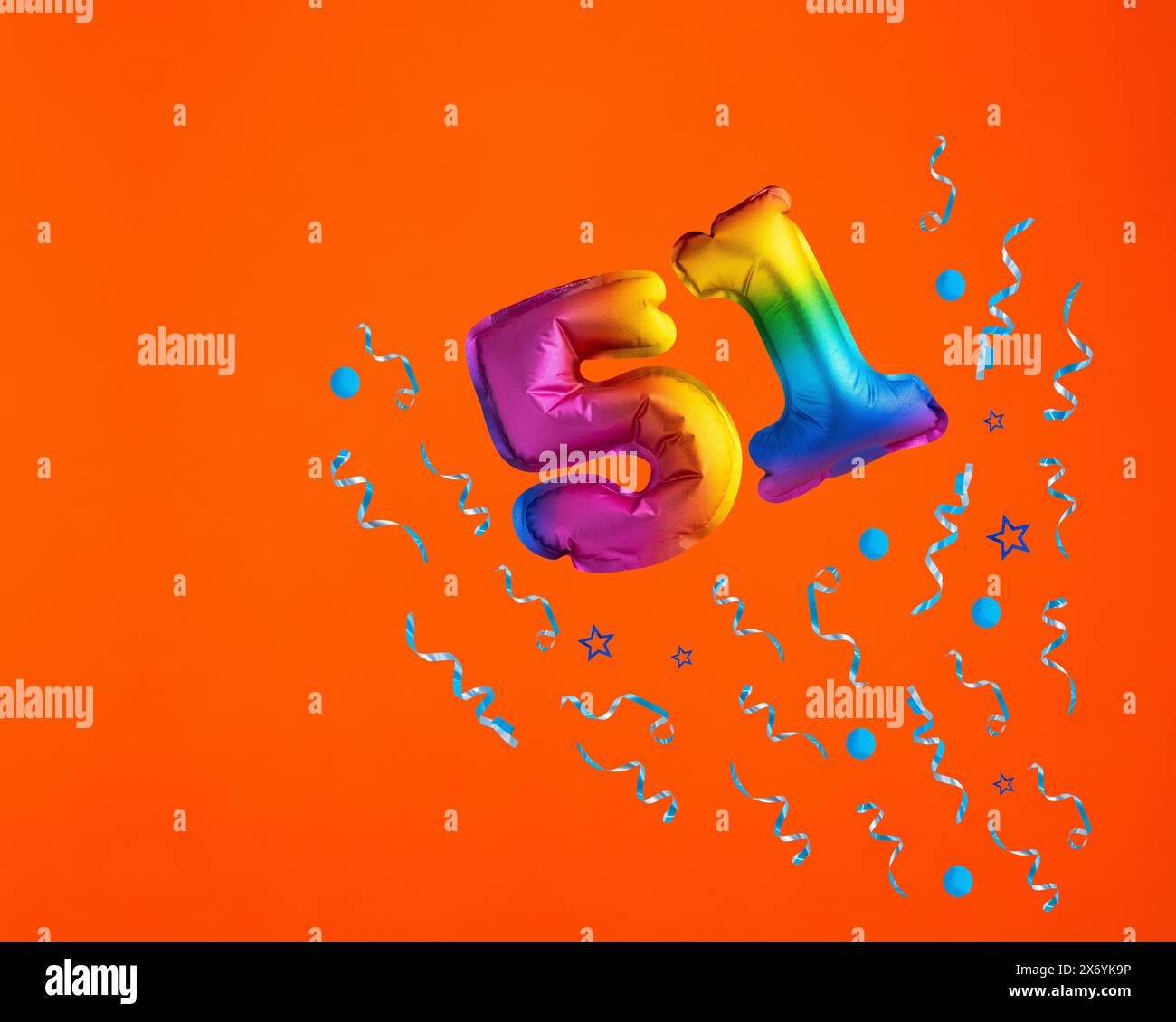 Confetti explosion with number 51 balloon - Celebration on orange ...