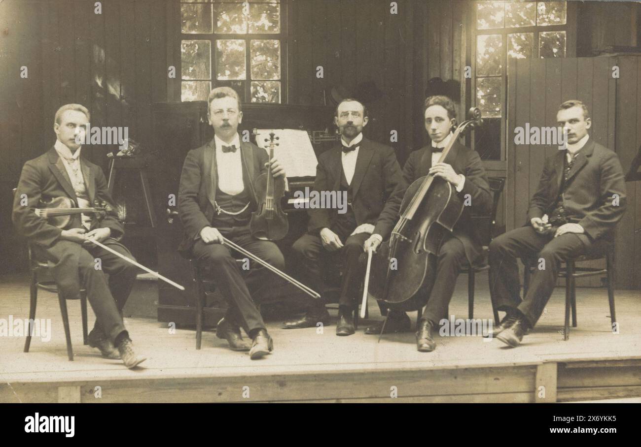 Group portrait of a music ensemble on a stage, photograph, Johan ...