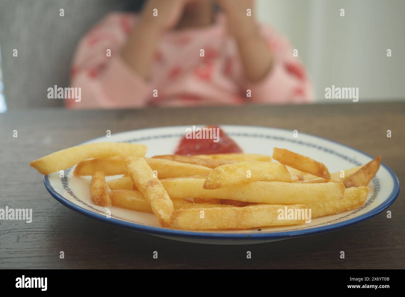 Kid hand french fries hi-res stock photography and images - Alamy