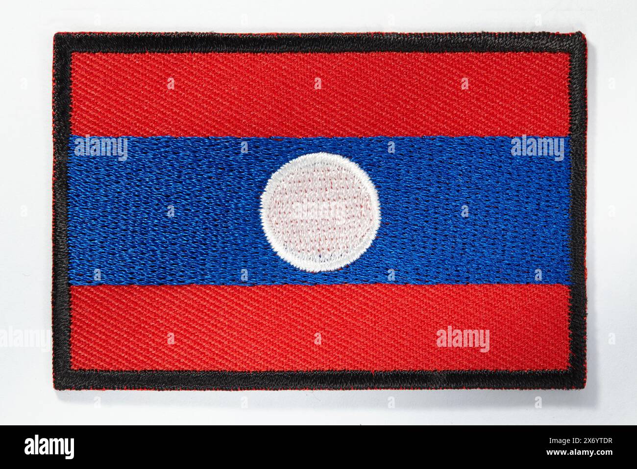 Laos national flag embroidered emblem on white background Stock Photo - Alamy