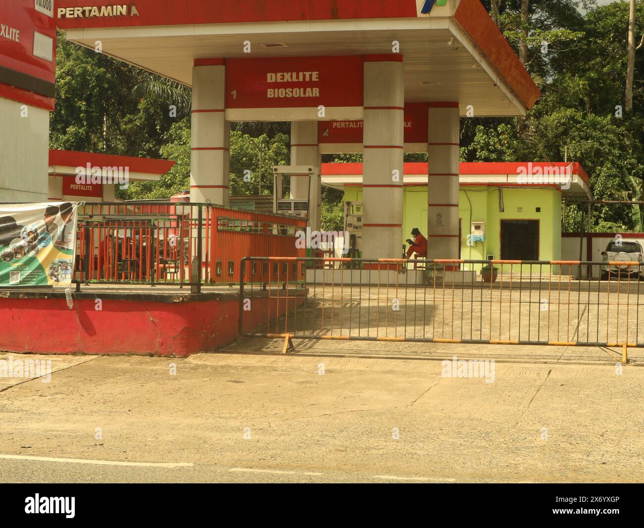 Refueling motor vehicles at gas stations. Kotabaru, South Kalimantan ...