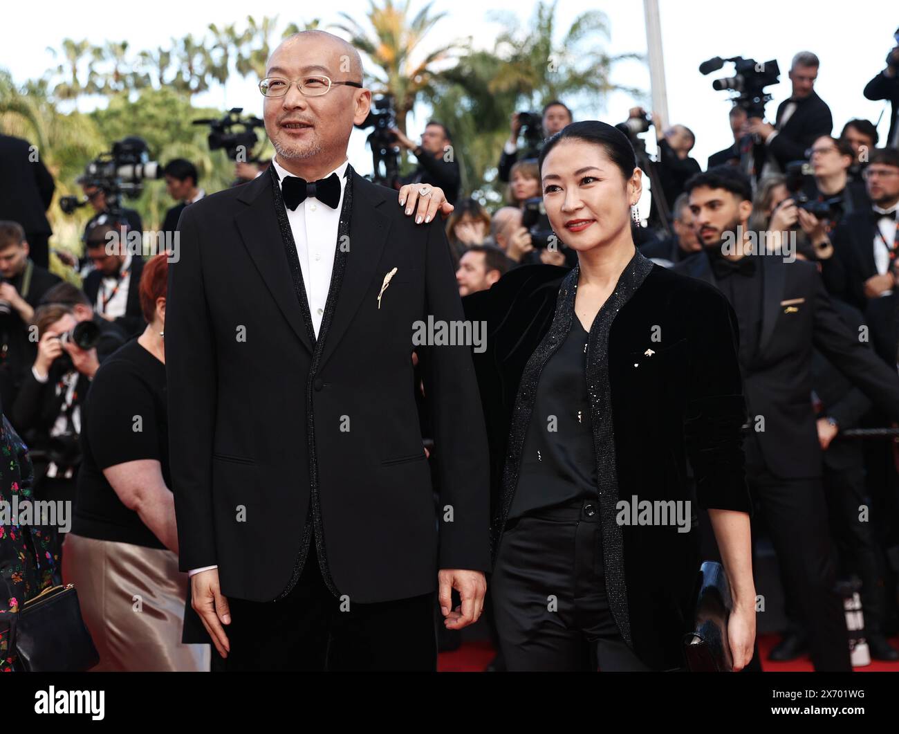 Cannes, France. 16th May, 2024. Chinese director Guan Hu (front L) and ...