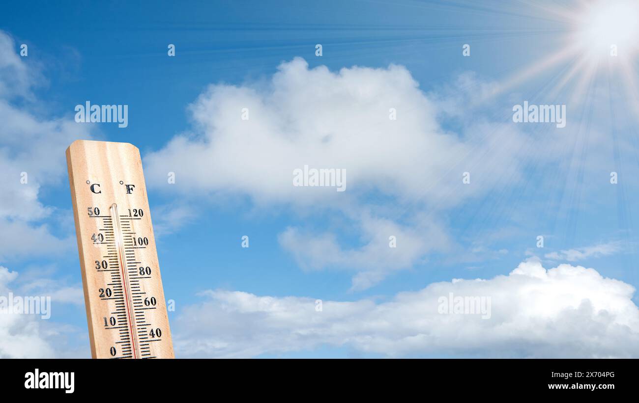 Thermometer with hot temperature with sky background. Environment ...