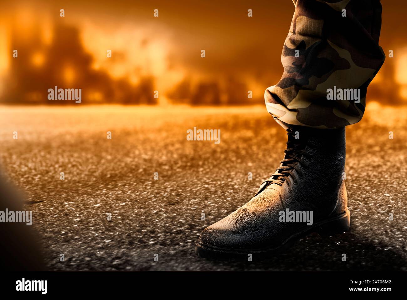 Soldier feet with military boots standing with fire and explosion on ...