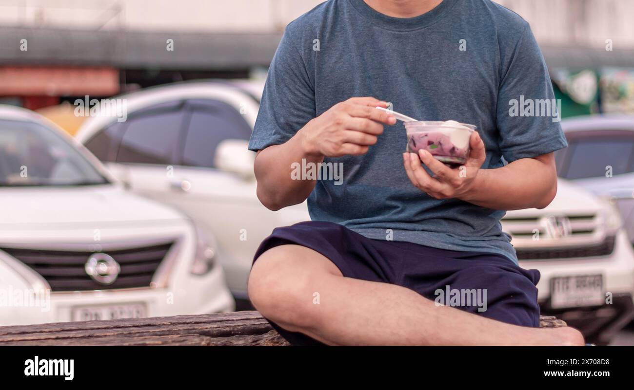 Human eating ice cream on summer vacation blurred background Stock ...