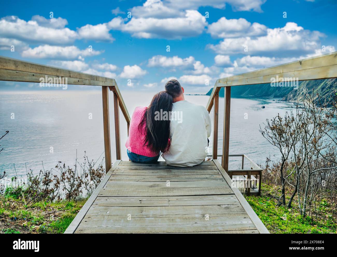 Two people sitting on stairs hi-res stock photography and images - Alamy