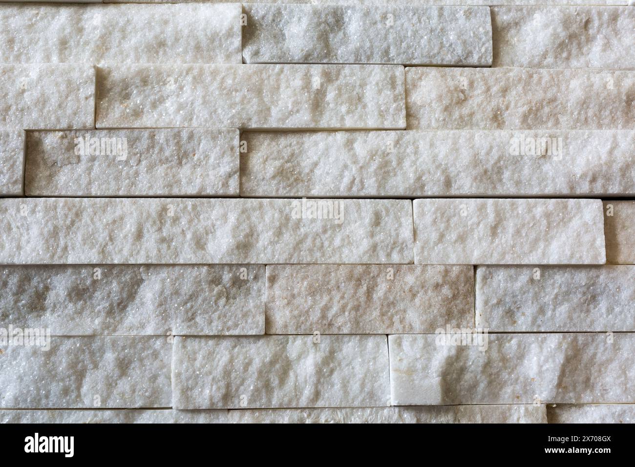 Stone cladding wall made of regular bricks of white, gray Stock Photo ...