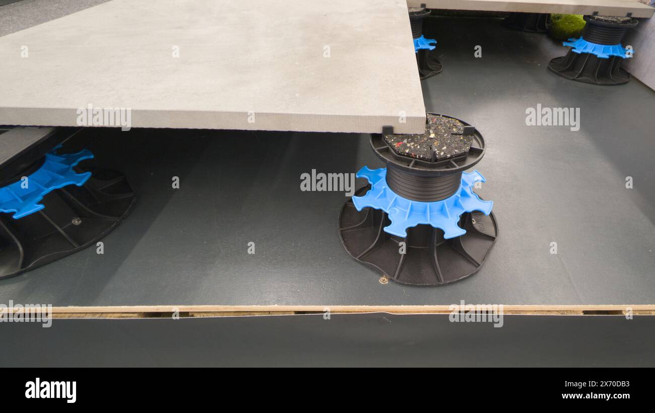 plots pavement grey tiles installation on house terrace with adjustable ...