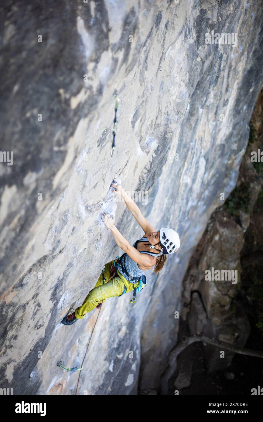 Women climbing in mountains, courage safety and determination Stock ...