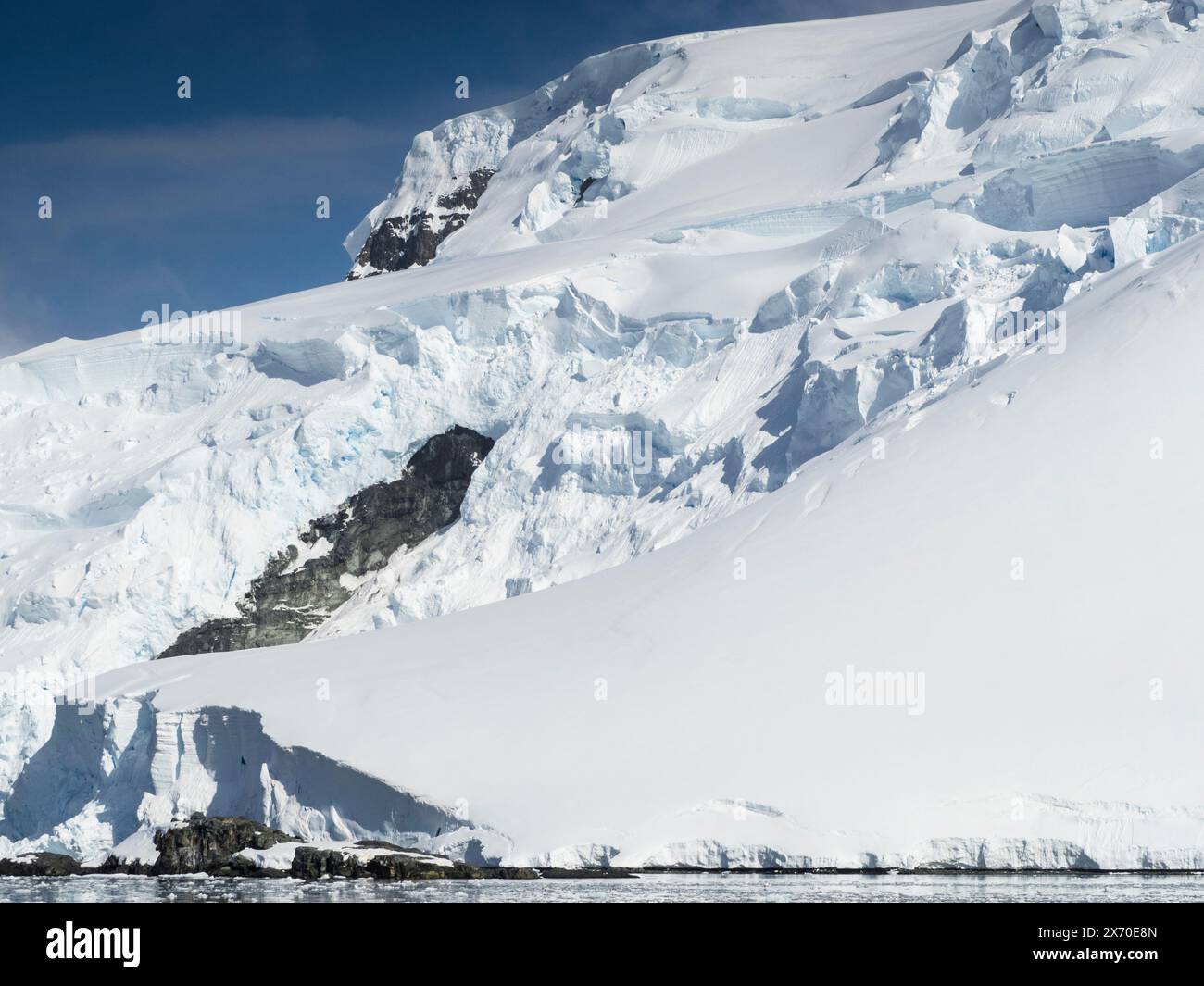 Hanging glacier over Mikkelsen Harbour, Trinity Island, Antarctica ...