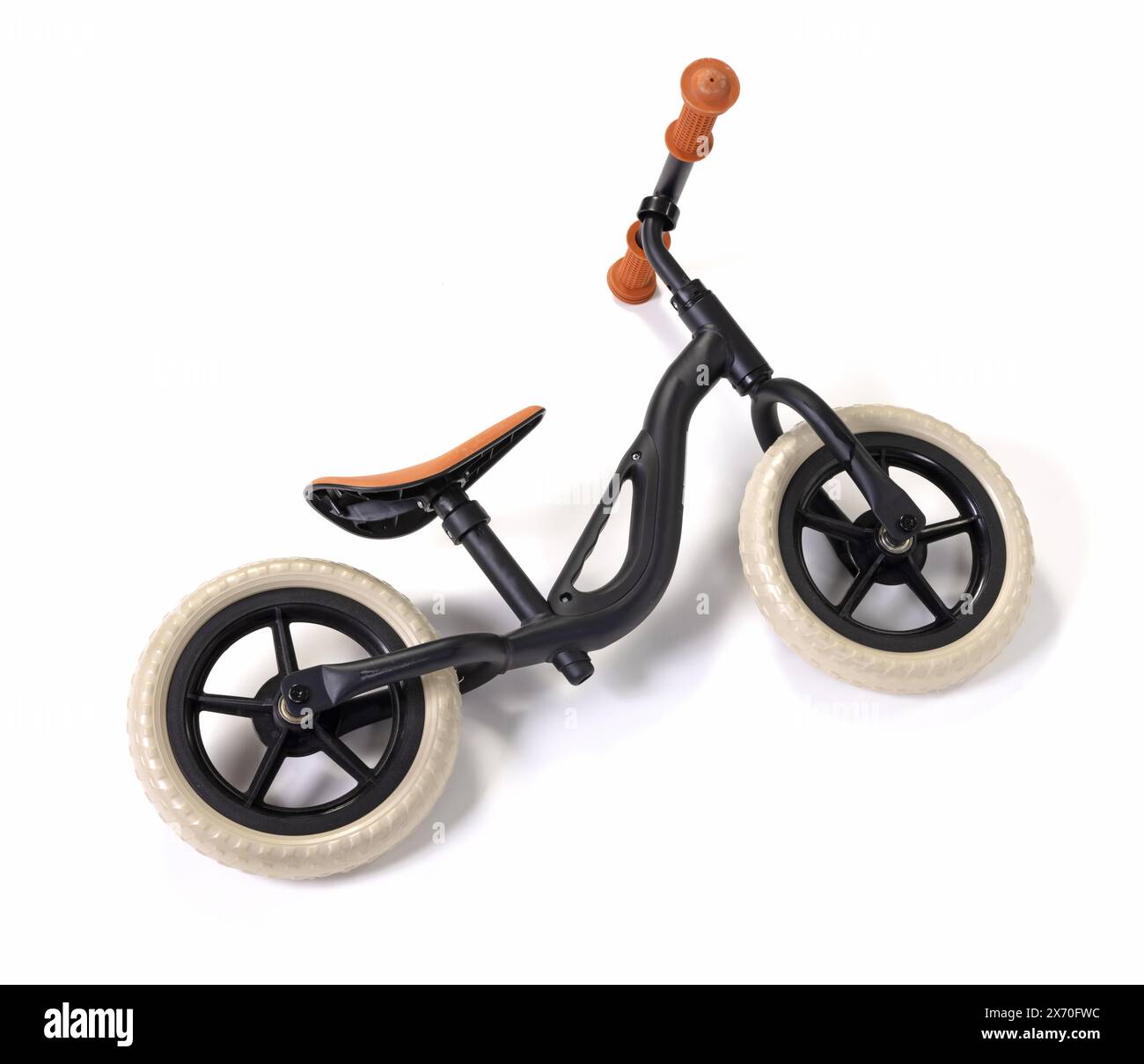 Used modern black balace bike for a small child, isolated on white ...