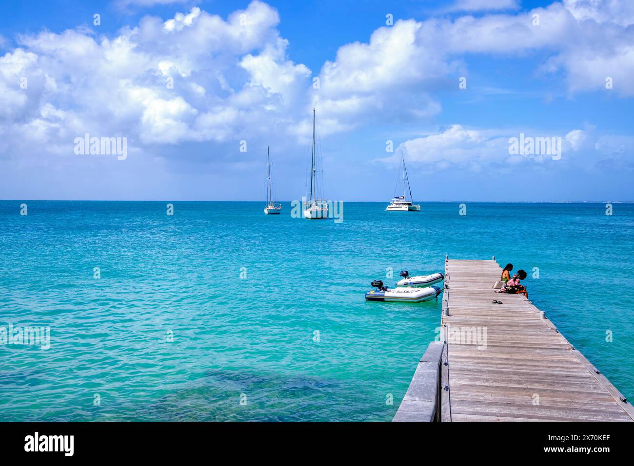 The Grand Case bay pier in French St. Martin Stock Photo - Alamy