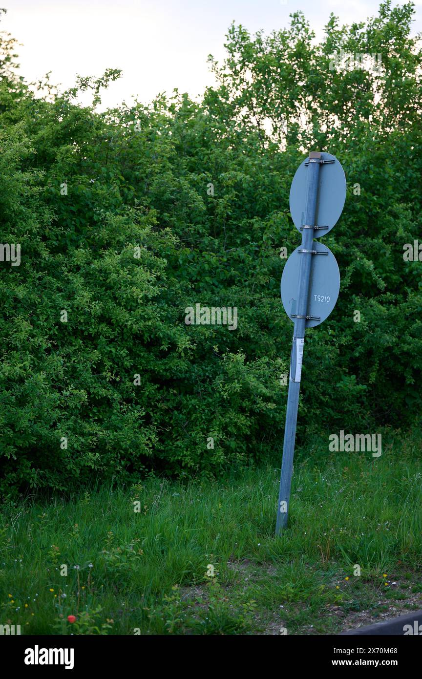 12 may 2025 - bedfordshire/uk - back of a road sign on a grass verge ...