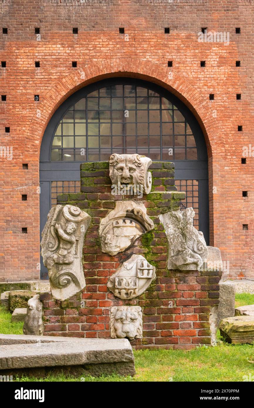 architectural relics in front of brick wall Stock Photo - Alamy