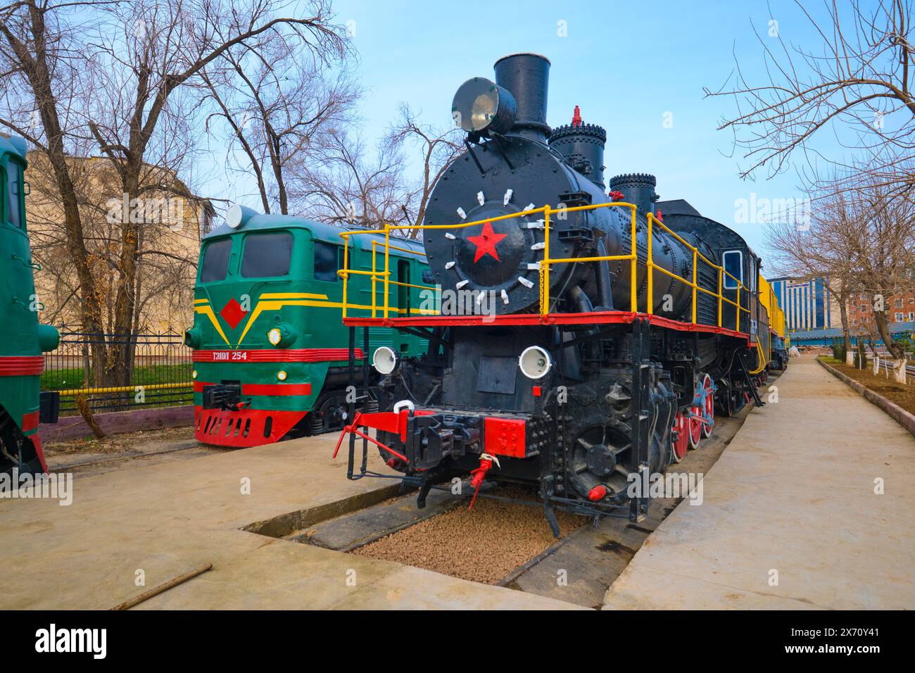 View of the front of an old steam, black locomotive with red star and ...