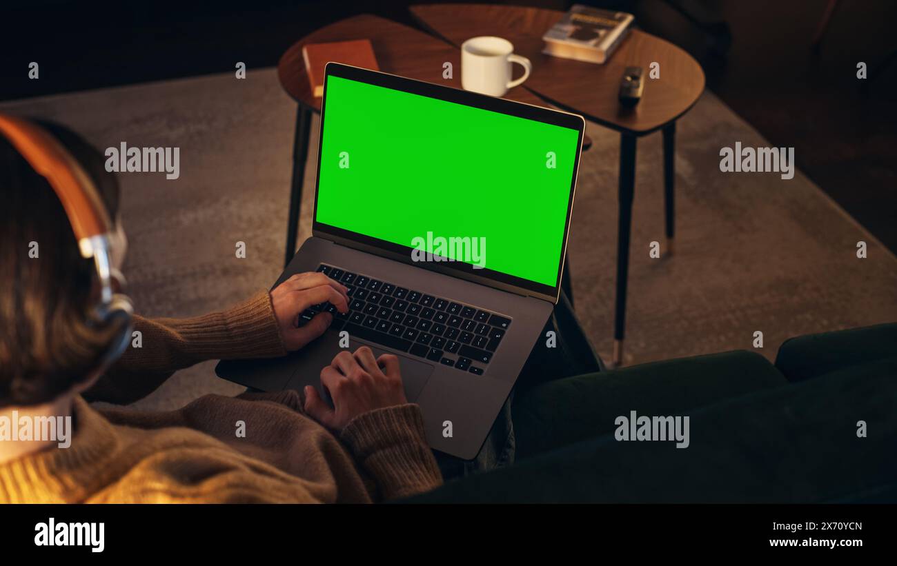 Young Man Working from Home on Desktop Computer with Green Screen Mock ...